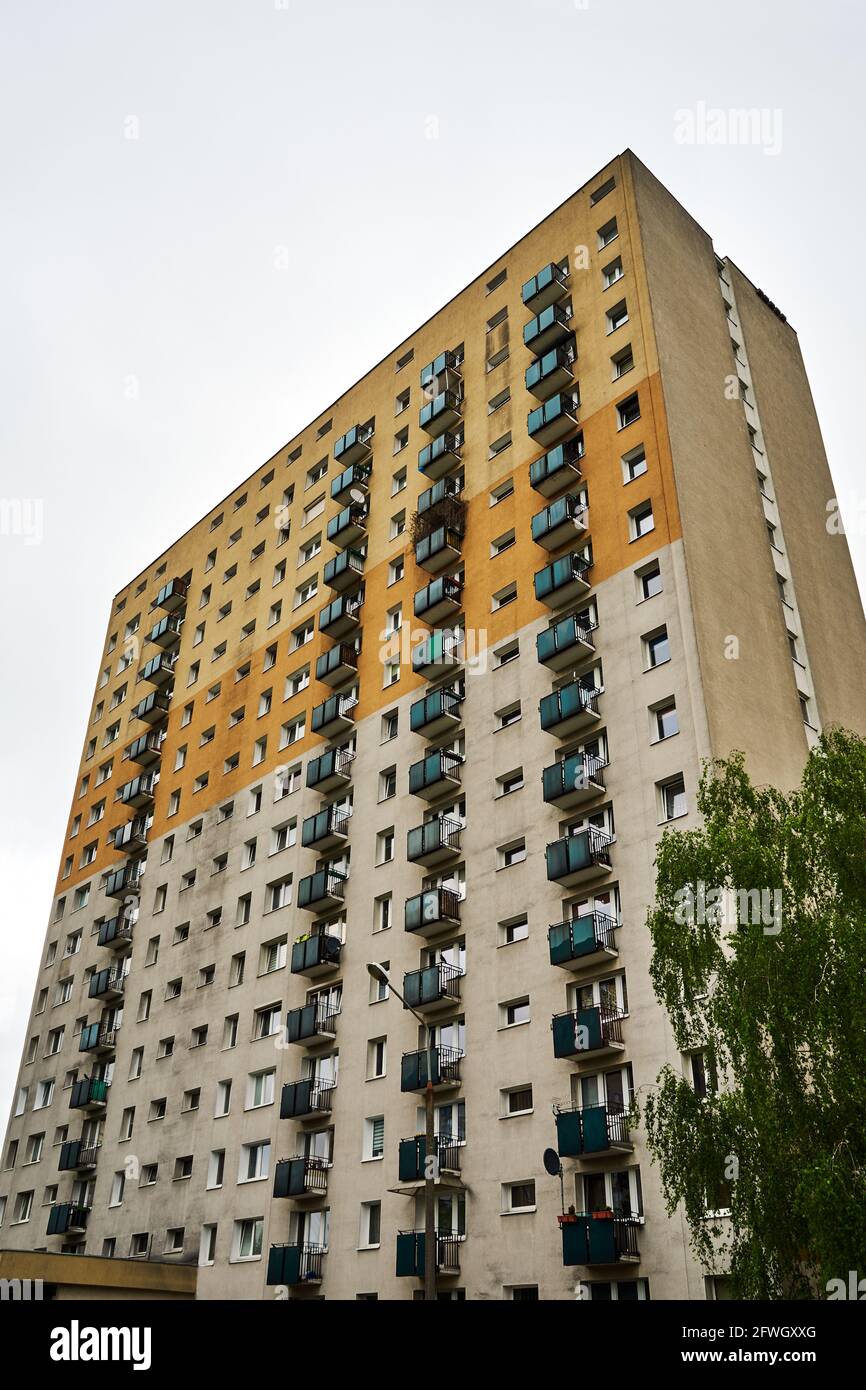 The facade with balconies of a residential high-rise building in Poznan ...