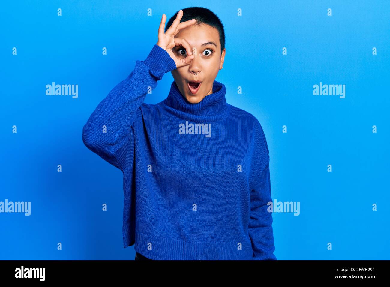 Beautiful hispanic woman with short hair wearing turtleneck sweater ...