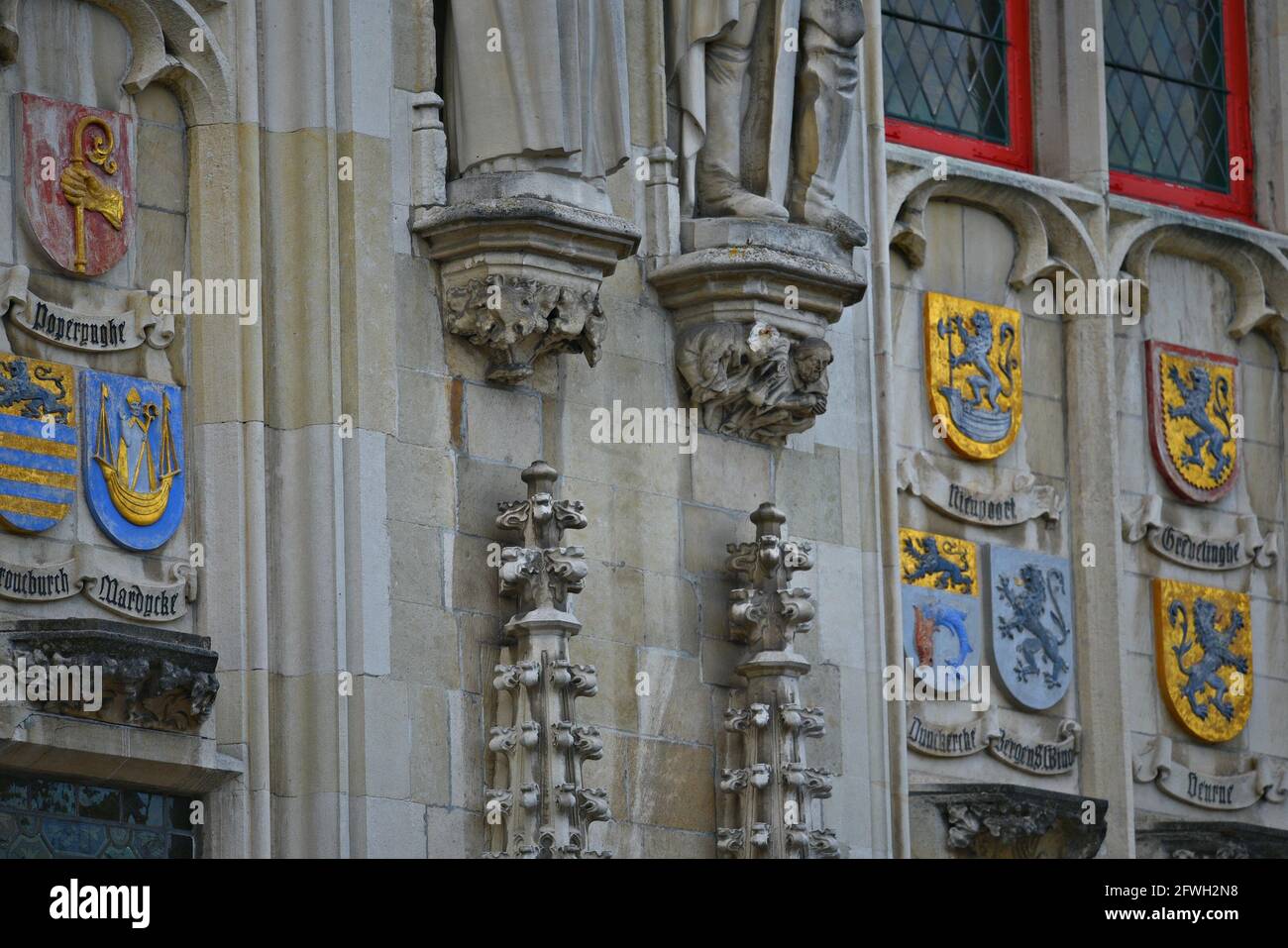 Scenic facade view with historic emblems and stone statues of the ...