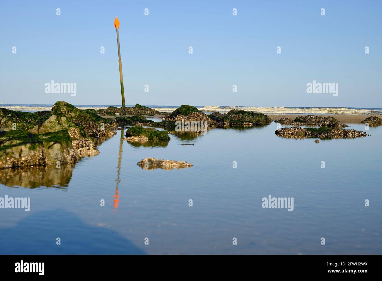 Warning sign on breakwater at South beach in The Hague, Netherlands ...