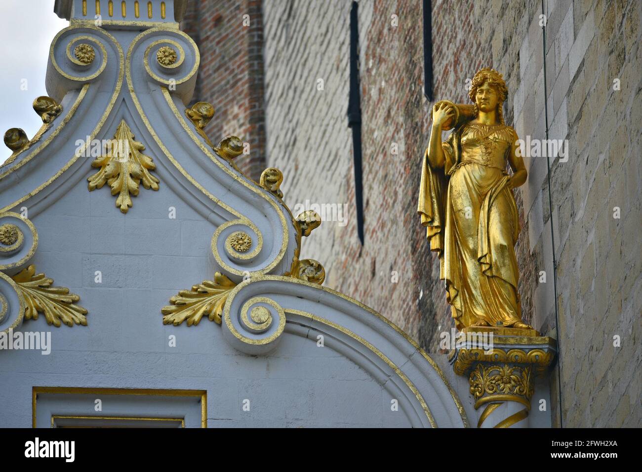Scenic view of a gilded bronze statue atop the Baroque style Brugse ...