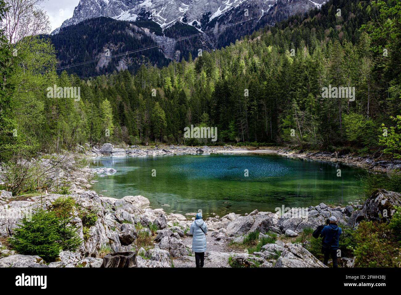 Green German sea with beautiful mountains and cloudy sky Stock Photo ...