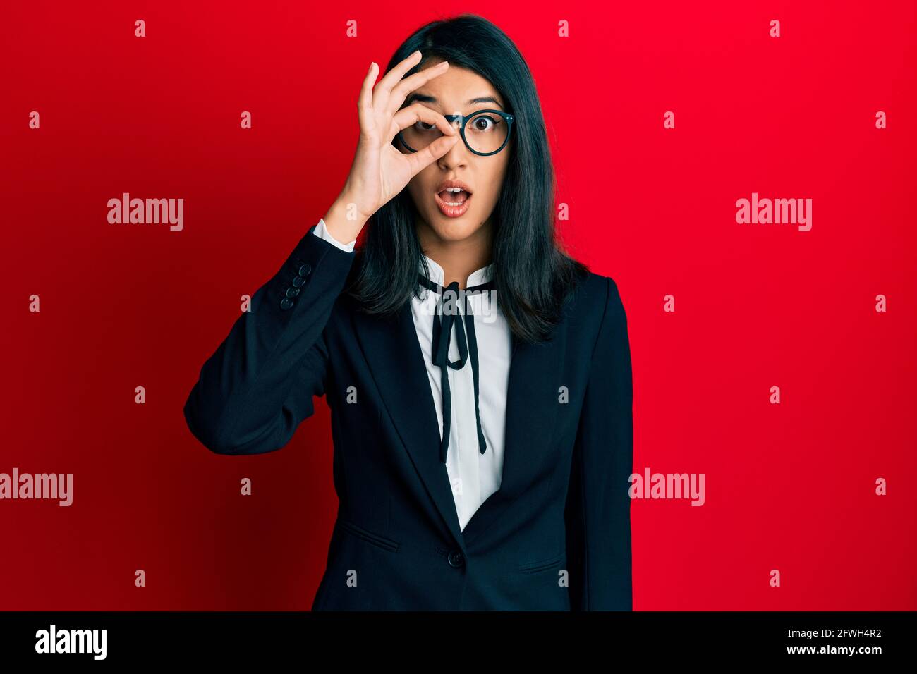 Beautiful asian young woman wearing business suit doing ok gesture ...