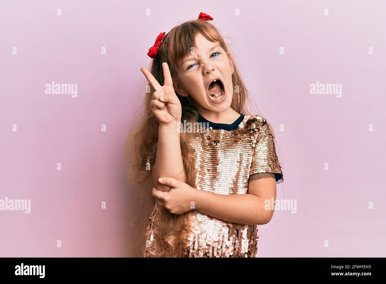 Little caucasian girl kid wearing festive sequins dress smiling with ...