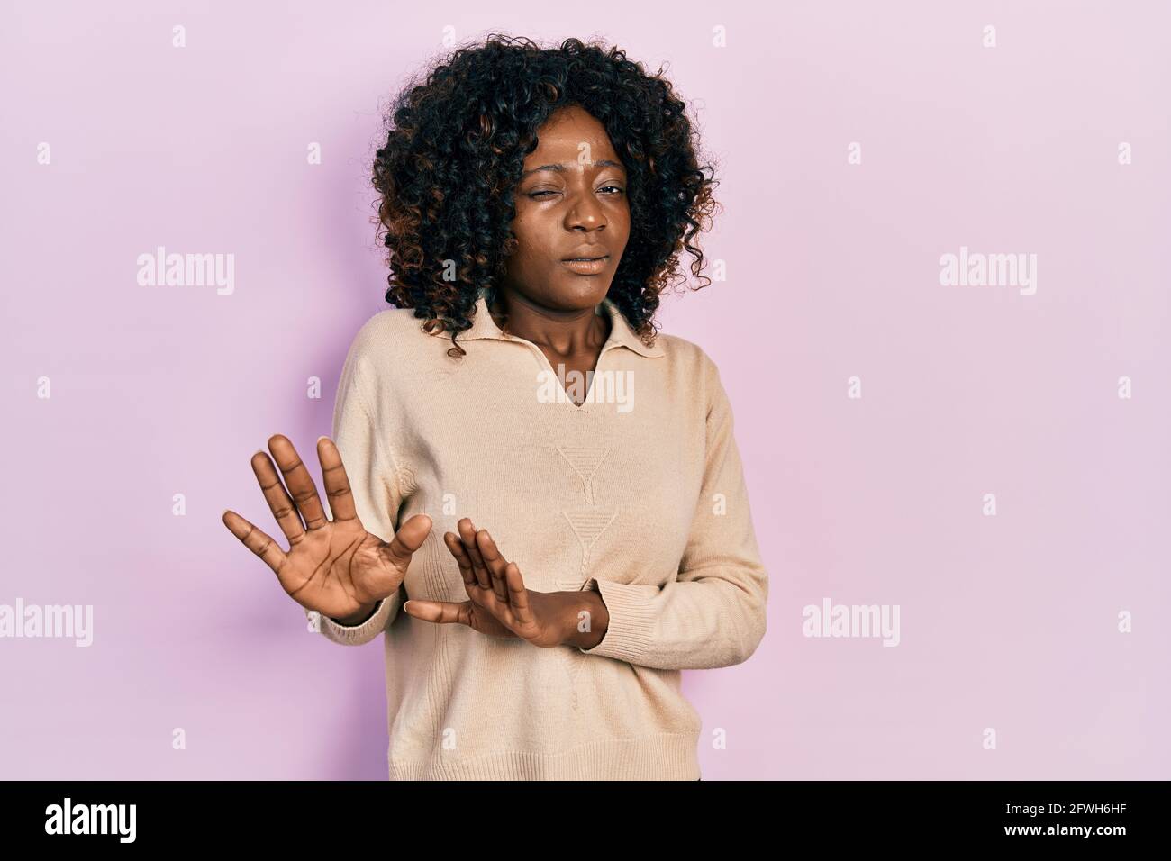 Young african american woman wearing casual clothes disgusted ...