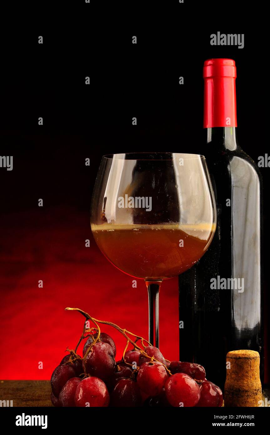 Glass and bottle of wine on the table Stock Photo - Alamy