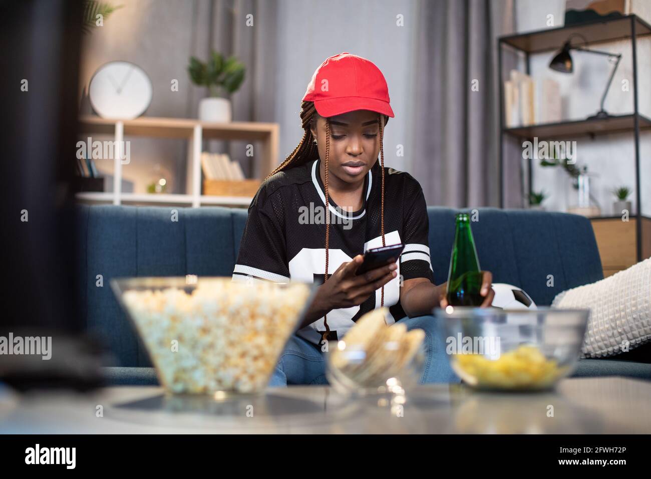 Football fan using mobile phone hi-res stock photography and images - Alamy