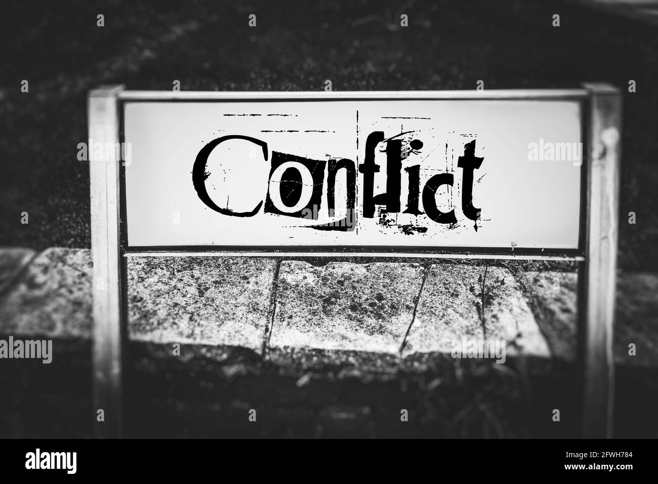 Conflict written on a street road sign in ransom note typography in ...