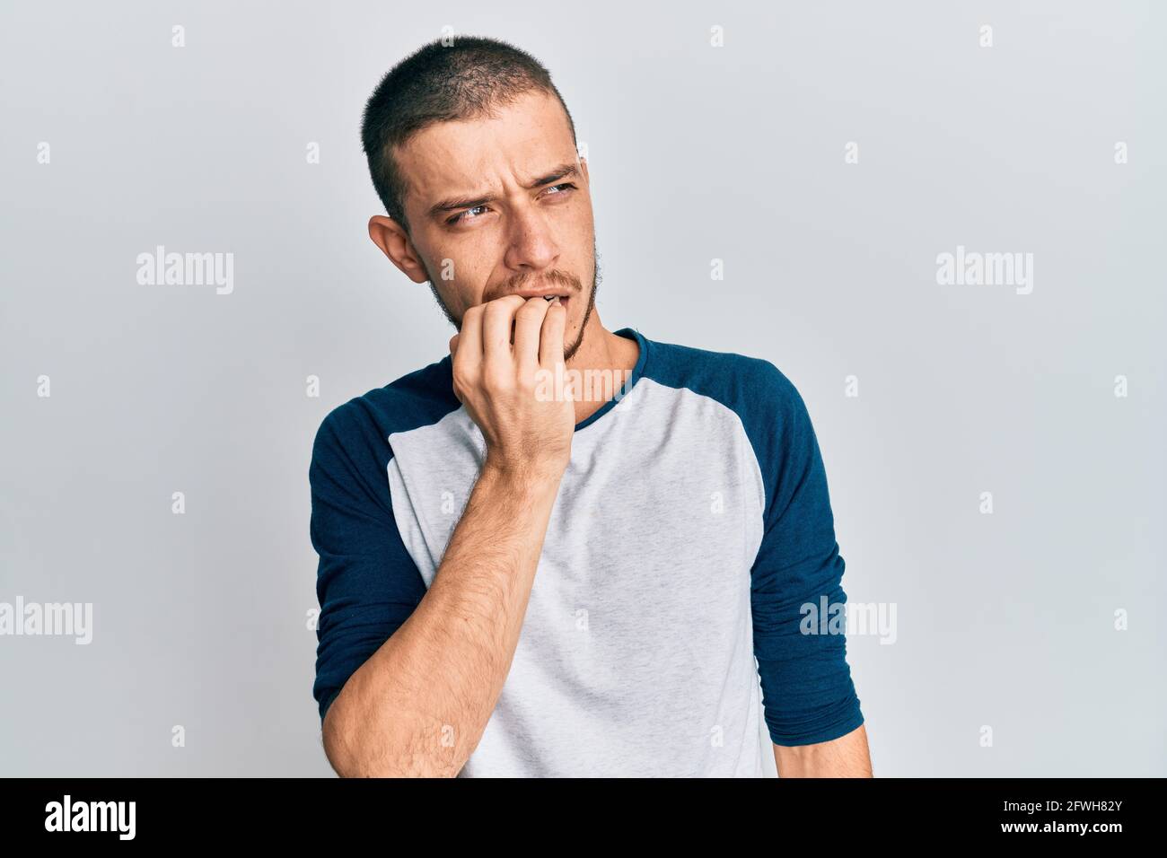 Hispanic young man wearing casual clothes looking stressed and nervous ...
