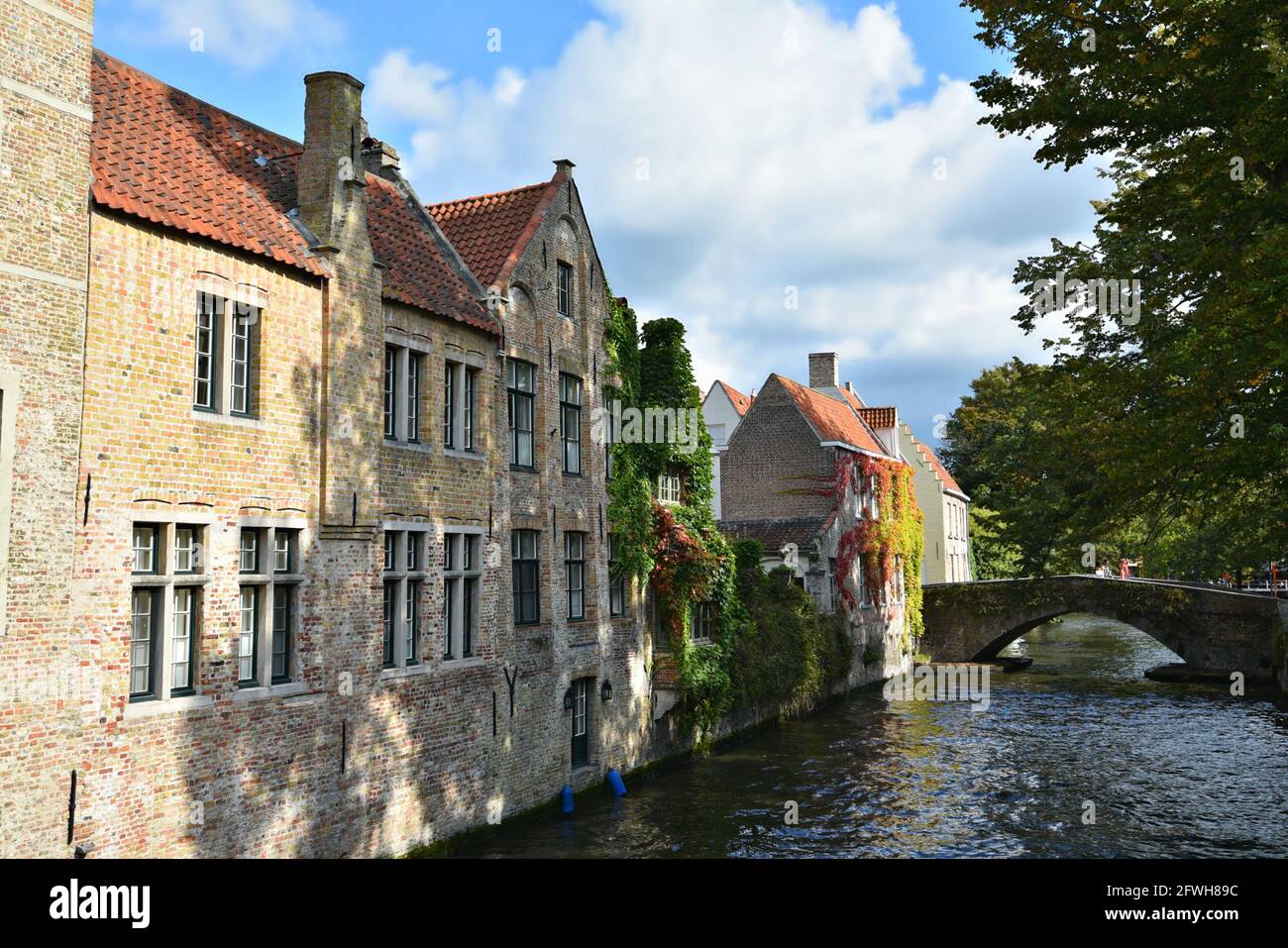 Scenic canal landscape with view of picturesque Gothic Revival style ...