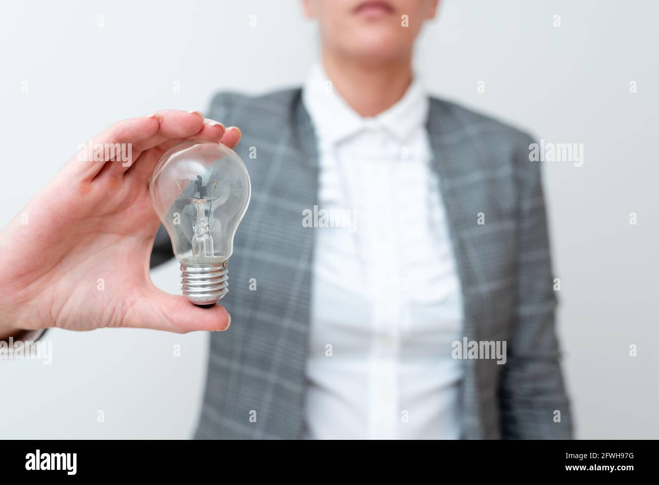 Lady Holding Lamp With Formal Outfit Presenting New Ideas For Project ...