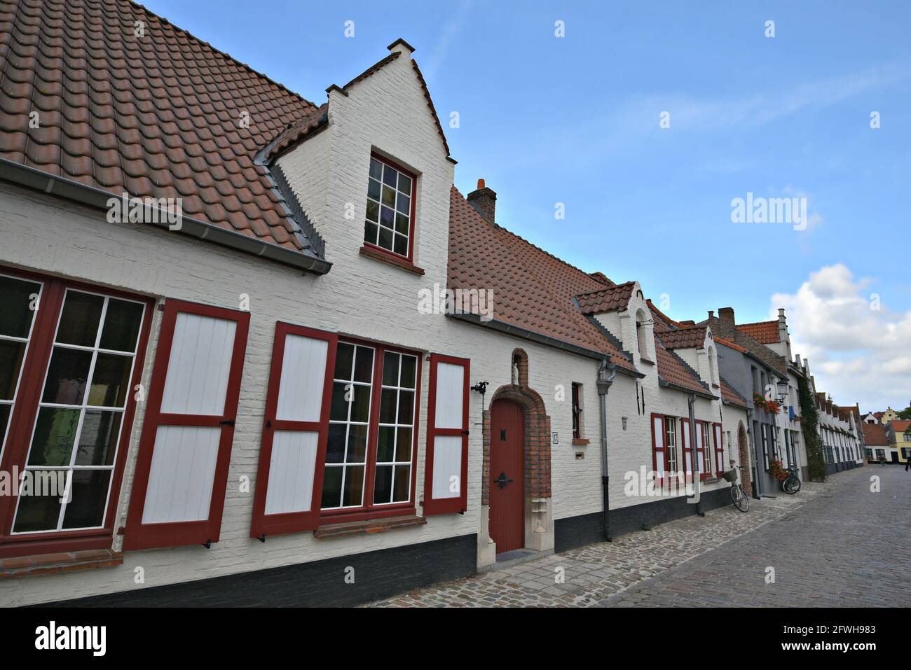 Cityscape with scenic view of picturesque Flemish rural houses with ...