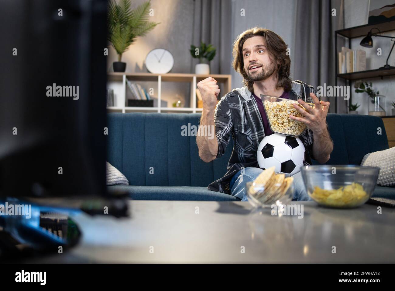 Man eating at football match hi-res stock photography and images - Alamy