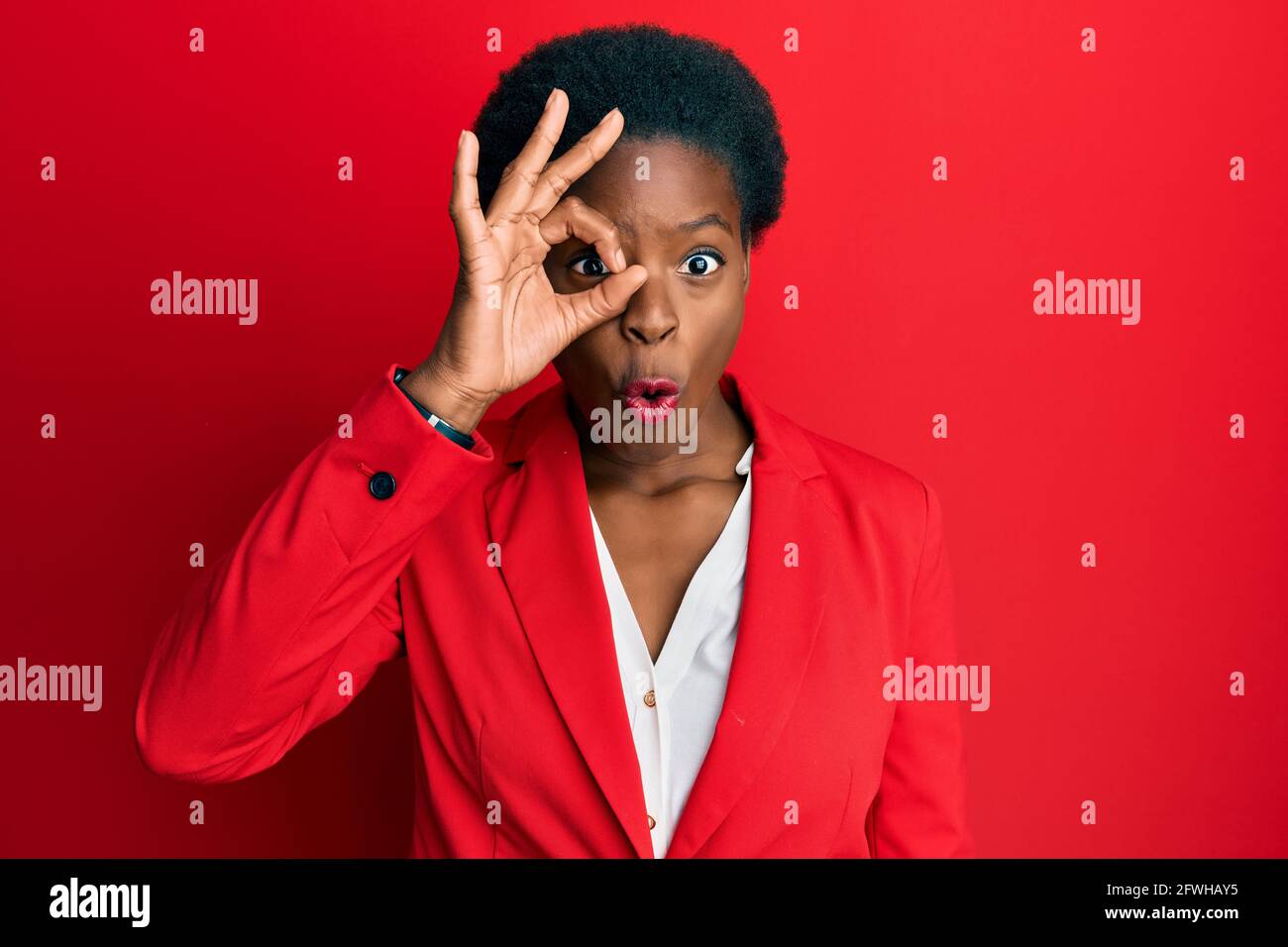 Young african american girl wearing business clothes doing ok gesture ...
