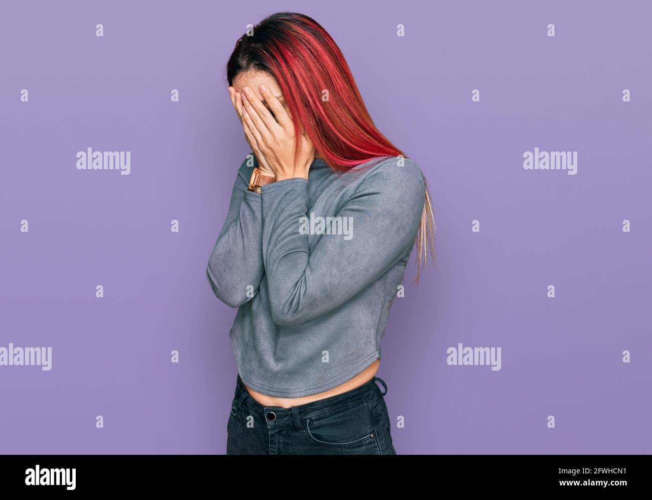 Young caucasian woman wearing casual clothes with sad expression ...