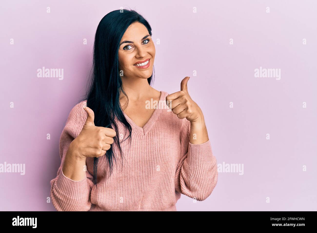 Young caucasian woman wearing casual clothes success sign doing ...