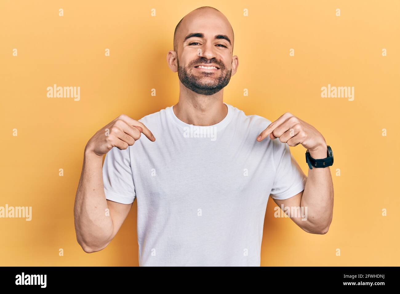 Young bald man wearing casual white t shirt looking confident with ...