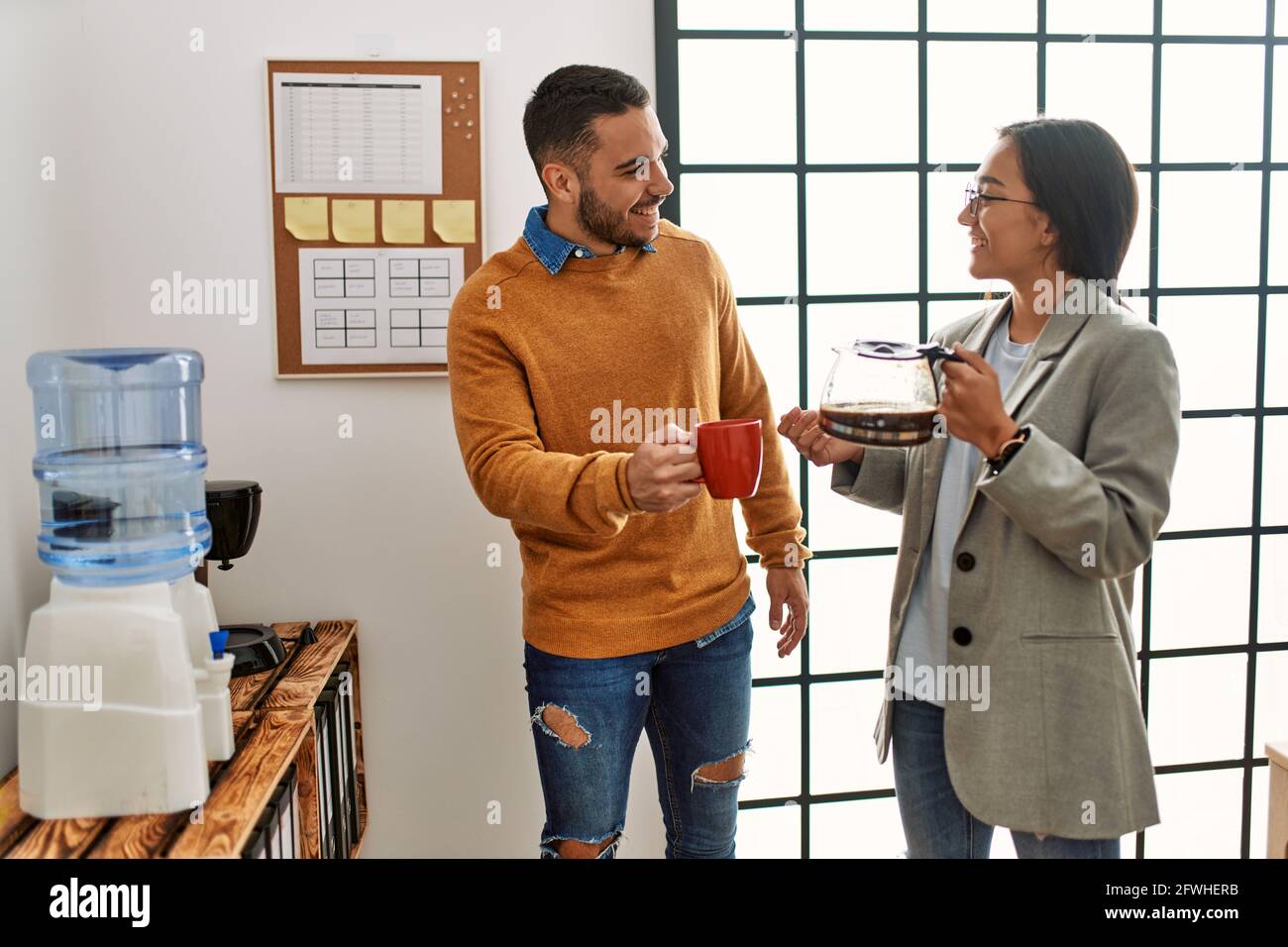 Two business workers relaxed drinking coffee at the office Stock Photo ...