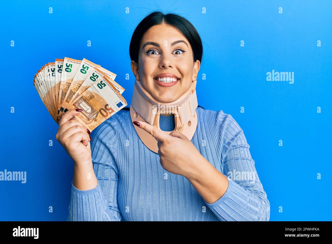 Beautiful brunette woman wearing cervical collar holding insurance ...