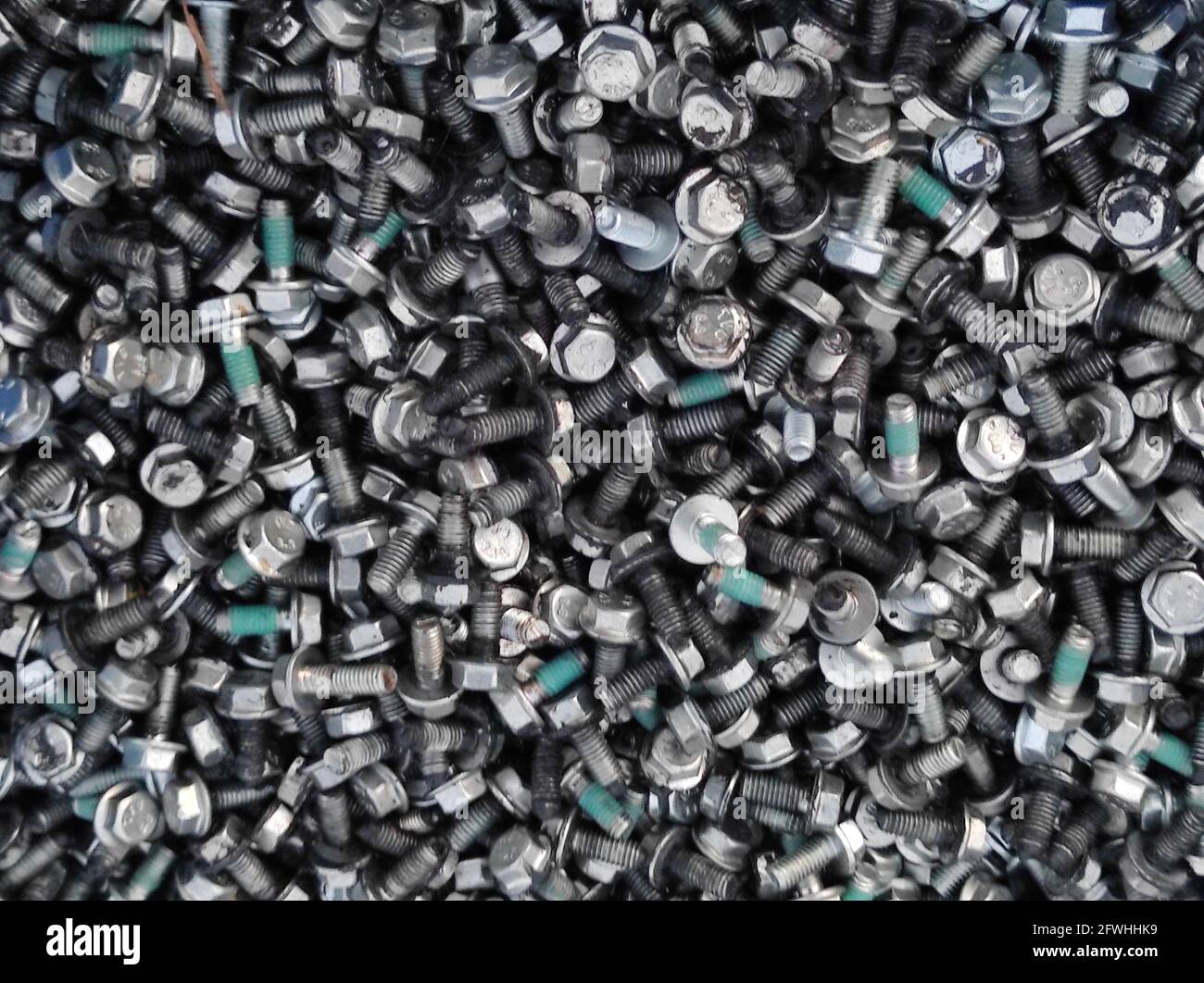 Texture of stacked metal bolts and nuts Stock Photo - Alamy