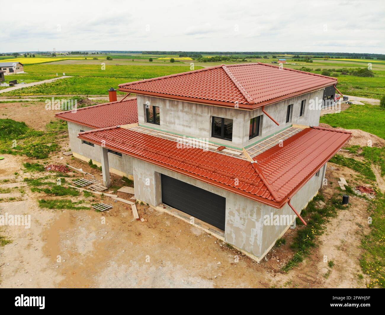 House with red roof tiling aerial view during summer Stock Photo - Alamy