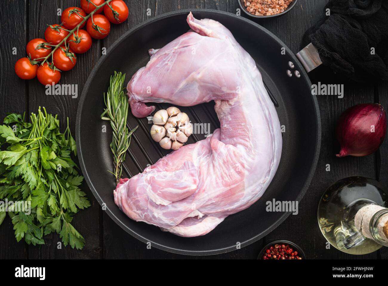 Raw and fresh meat. Whole rabbit ready to cook with ingredients set, in ...