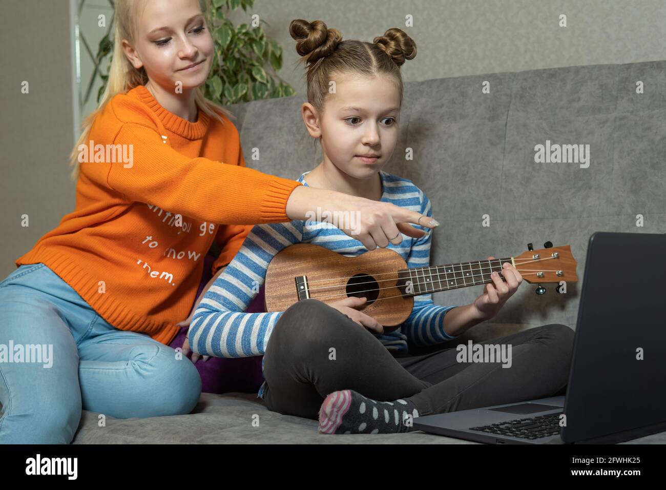 Creative teenagers friends with musical instruments, acoustic guitar ...