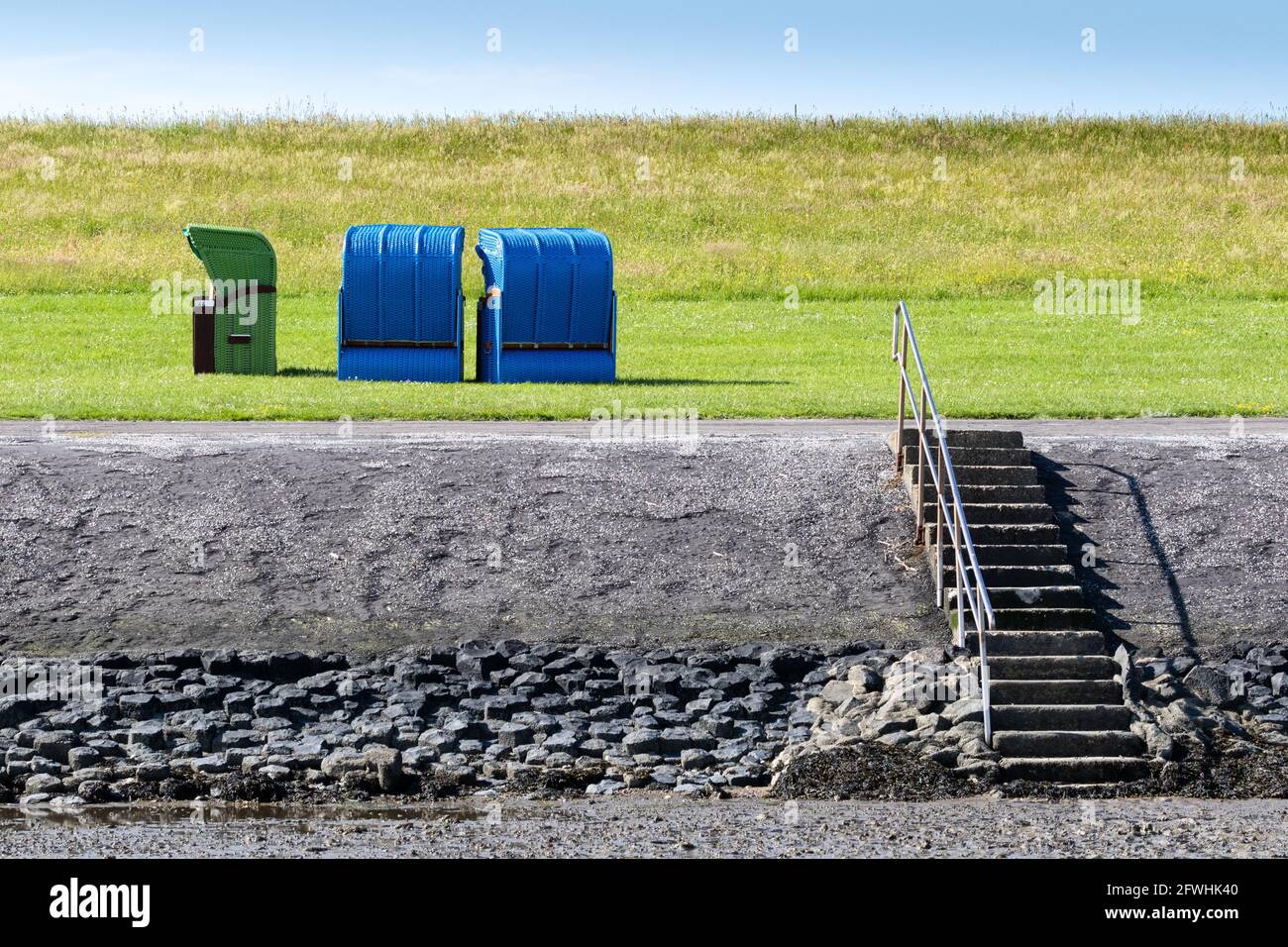 Stone stairs lead from the beach to the green dike on Pellworm. There ...