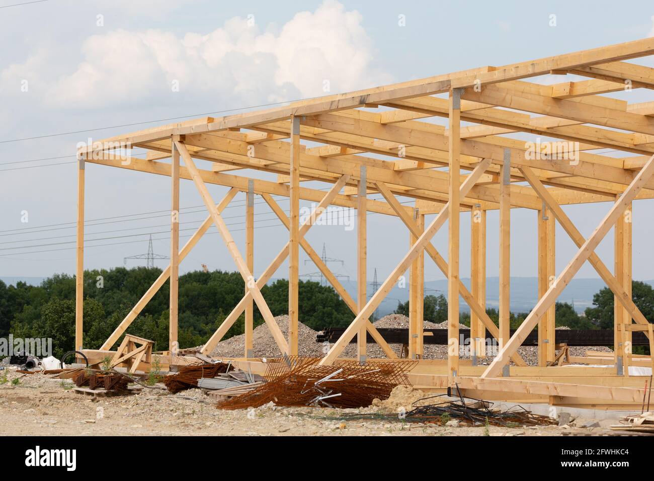 Timber frame construction, industrial hall, blue sky and clouds Stock ...