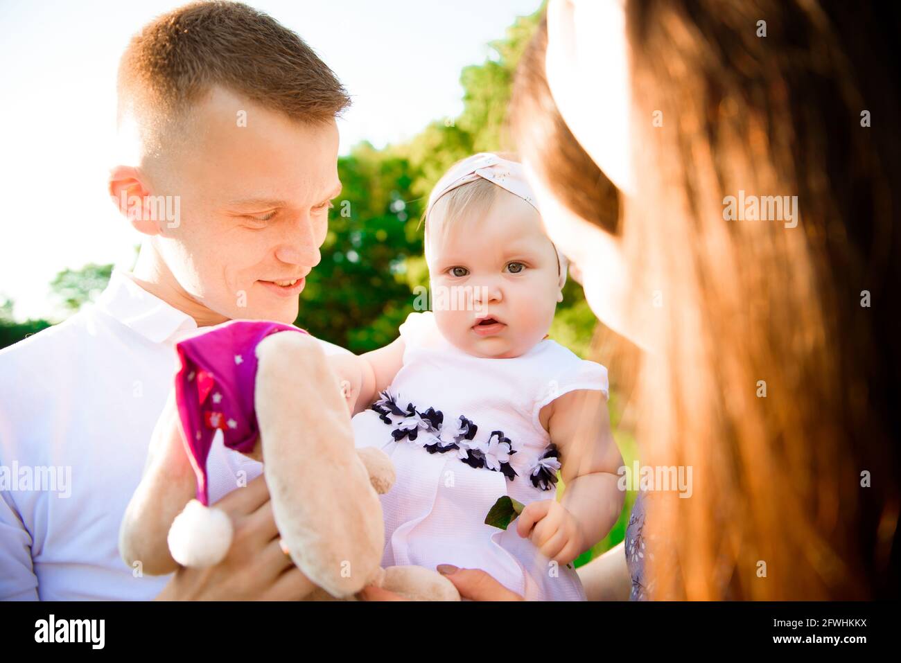 Happy family: mother father and child daughter on nature on sunset ...