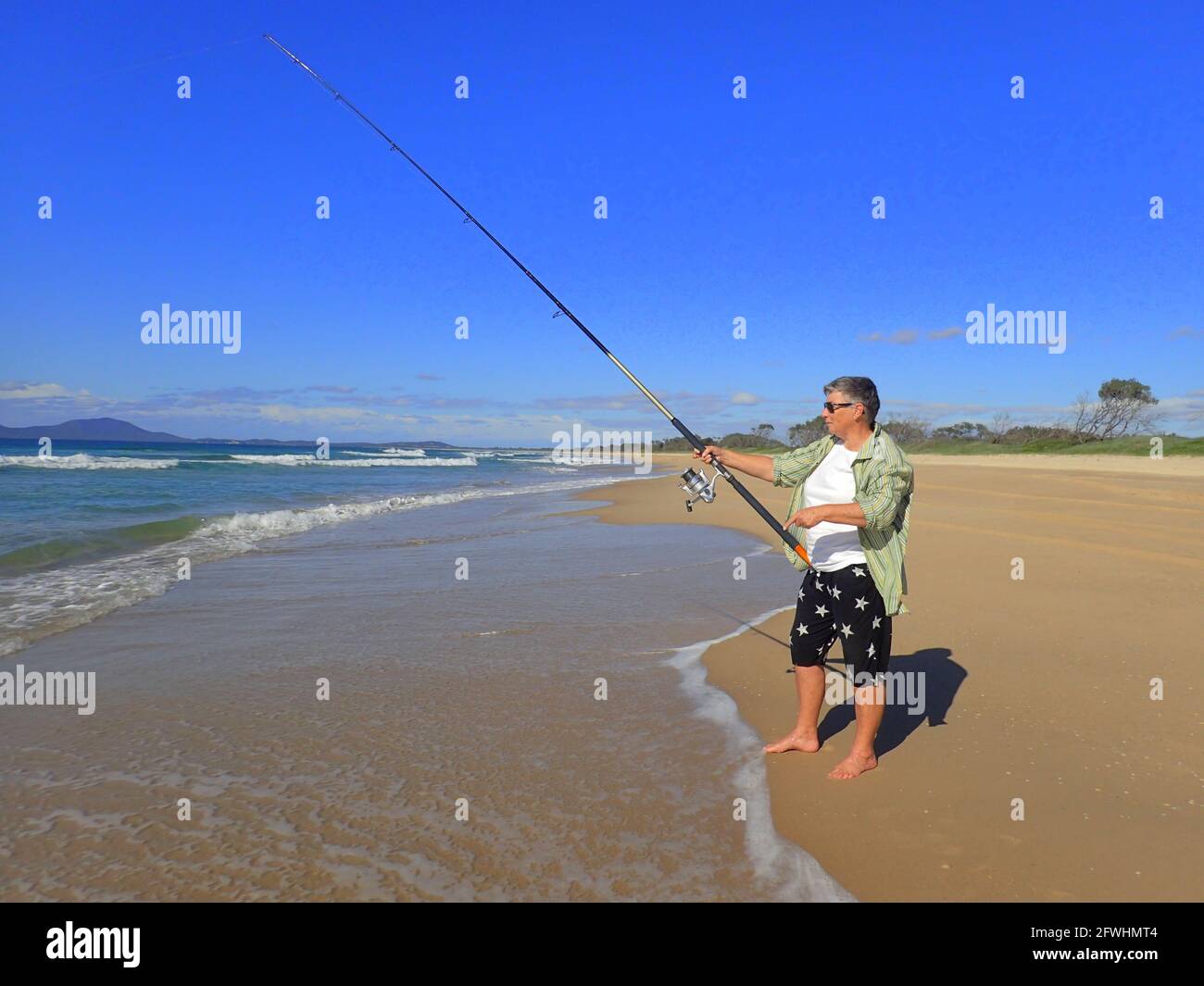 Surfcasting beach fishing hi-res stock photography and images - Alamy