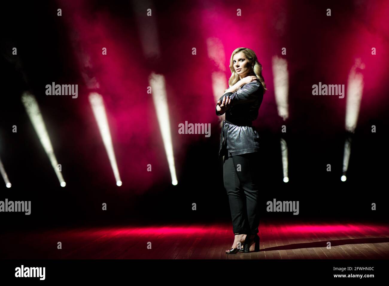 Young woman singer with colorful lights on concert Stock Photo - Alamy