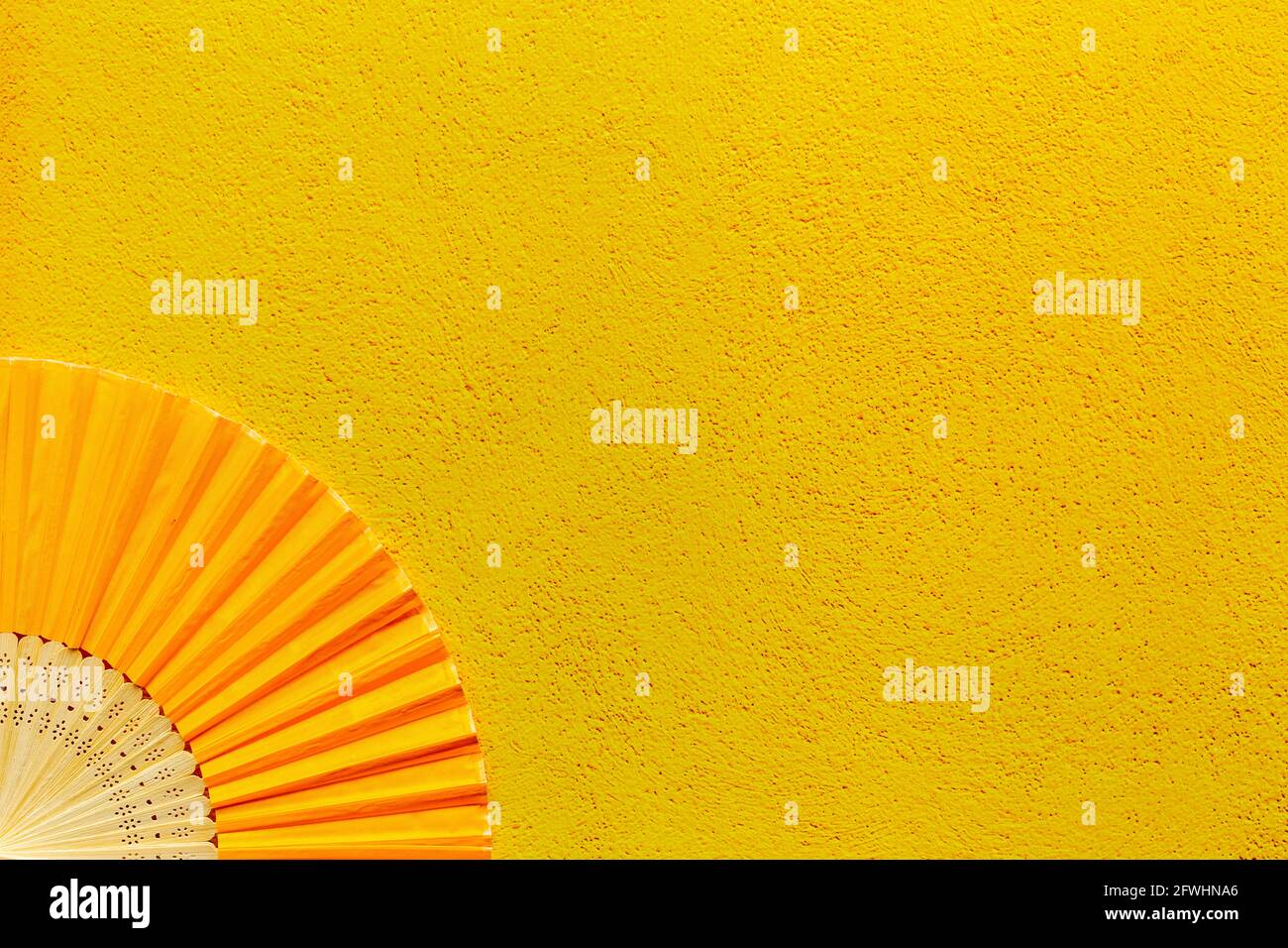 Yellow golden hand fan made of bamboo and paper. Top view Stock Photo ...
