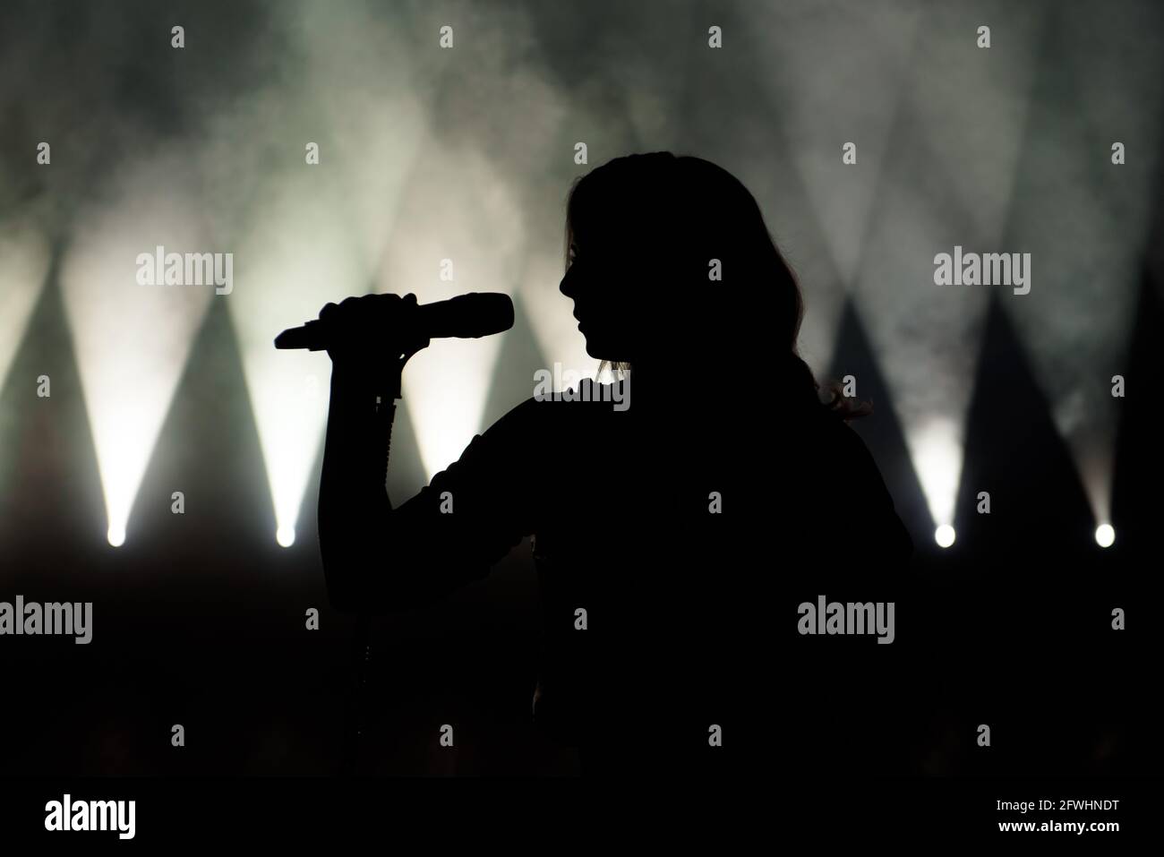 Singer in silhouette. Close up image of live singer on stage Stock ...
