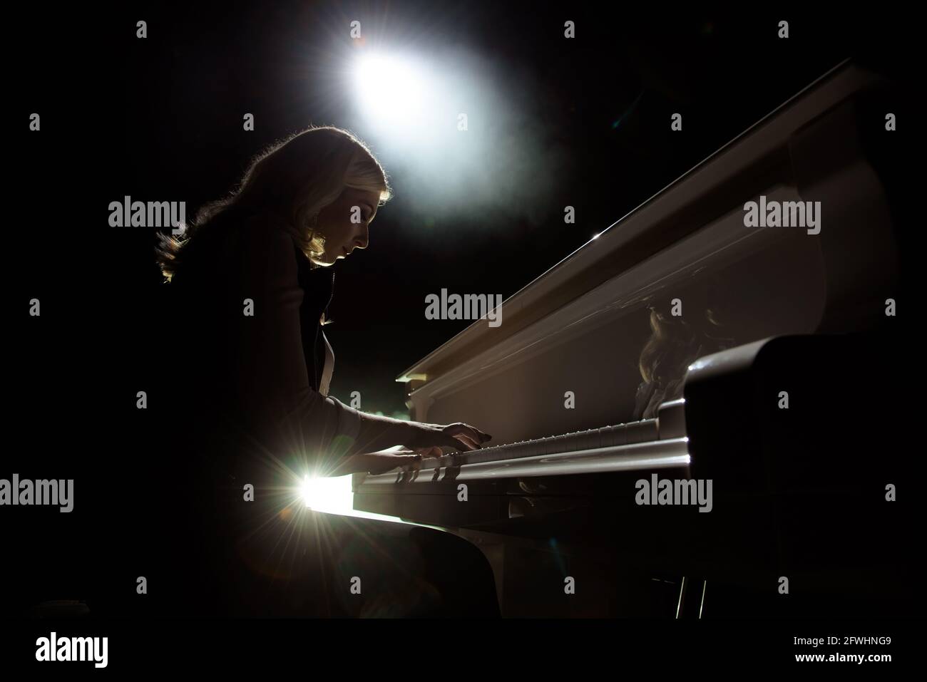 Close Up View Of A Girl Plays Piano In The Concert Hall At Scene Stock 1593