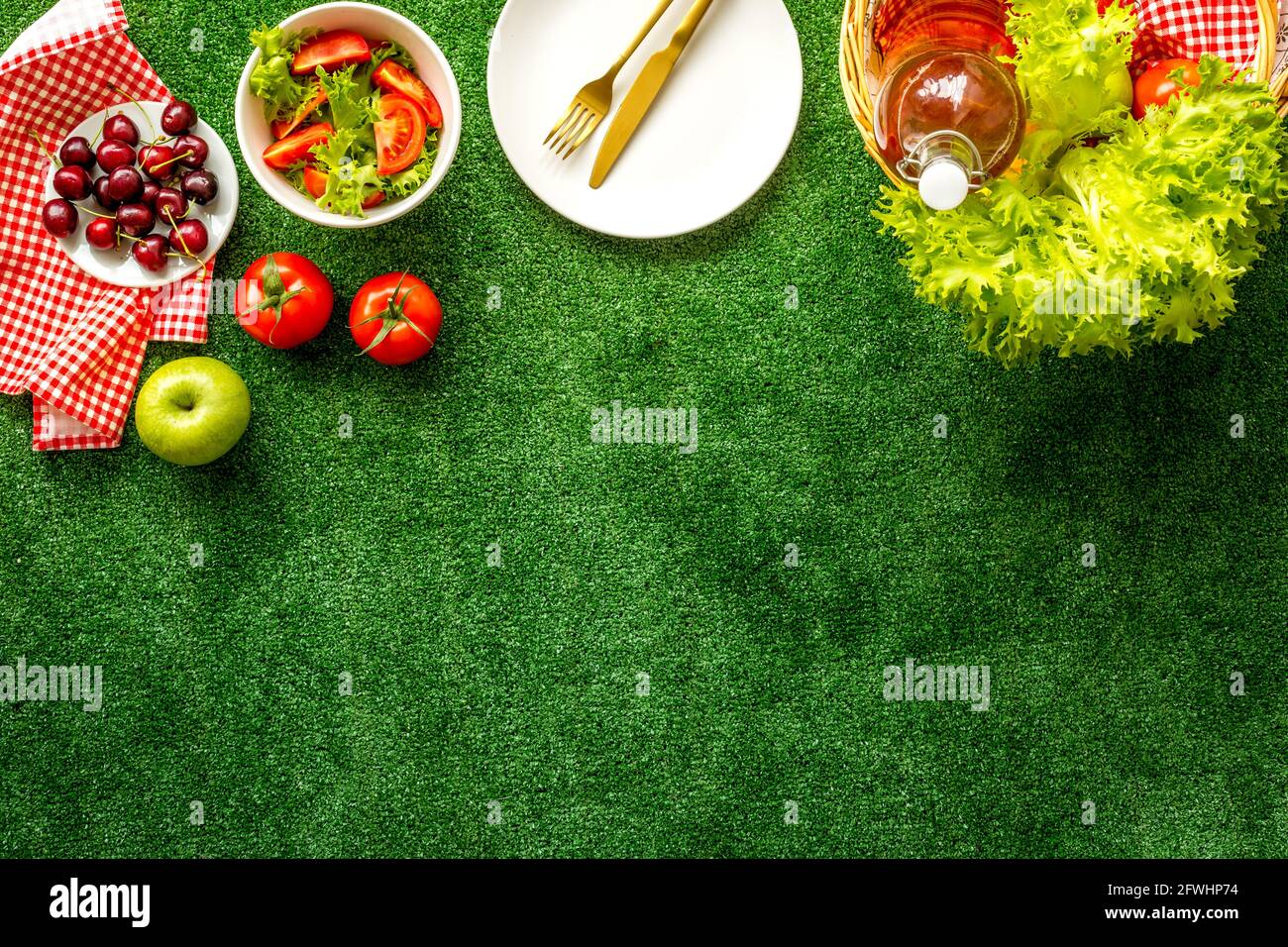 Summer picnic setting. Basket with food on red cloth, top view Stock ...