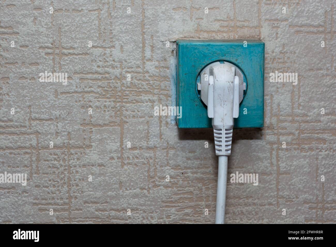 old plug and socket in the wall on paper wallpaper background Stock ...