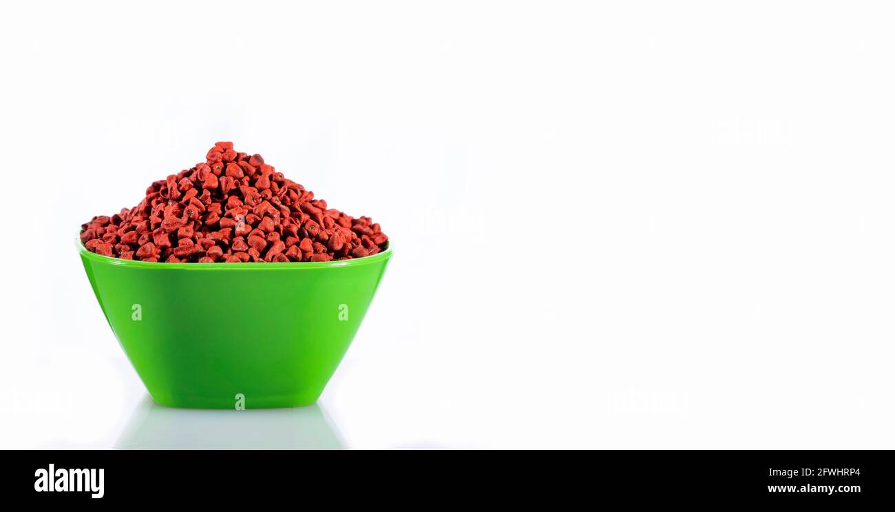 Organic achiote in the green bowl - Bixa orellana Stock Photo - Alamy