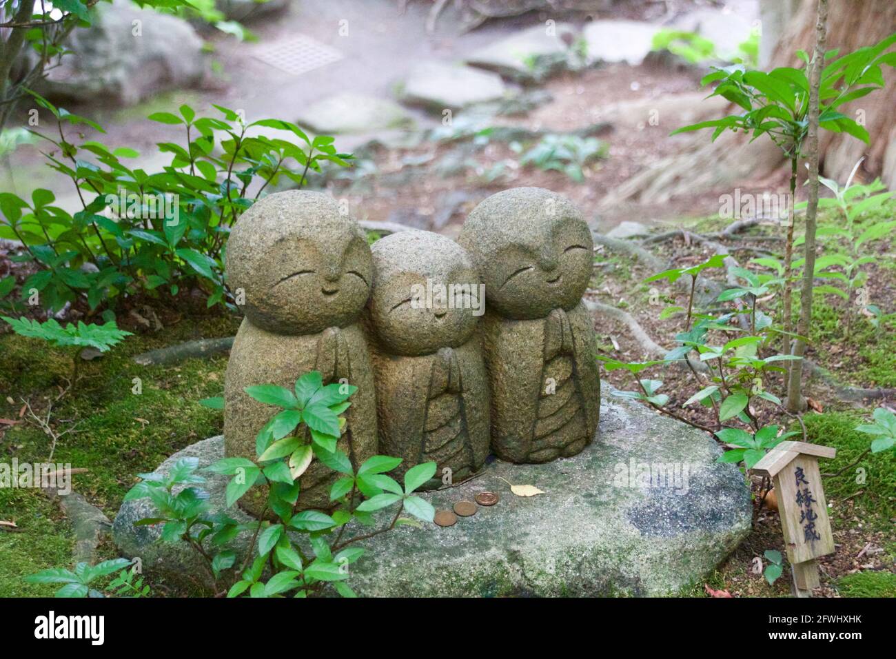 Little Buddha statues lined up in a Buddhist temple garden in Kamakura ...