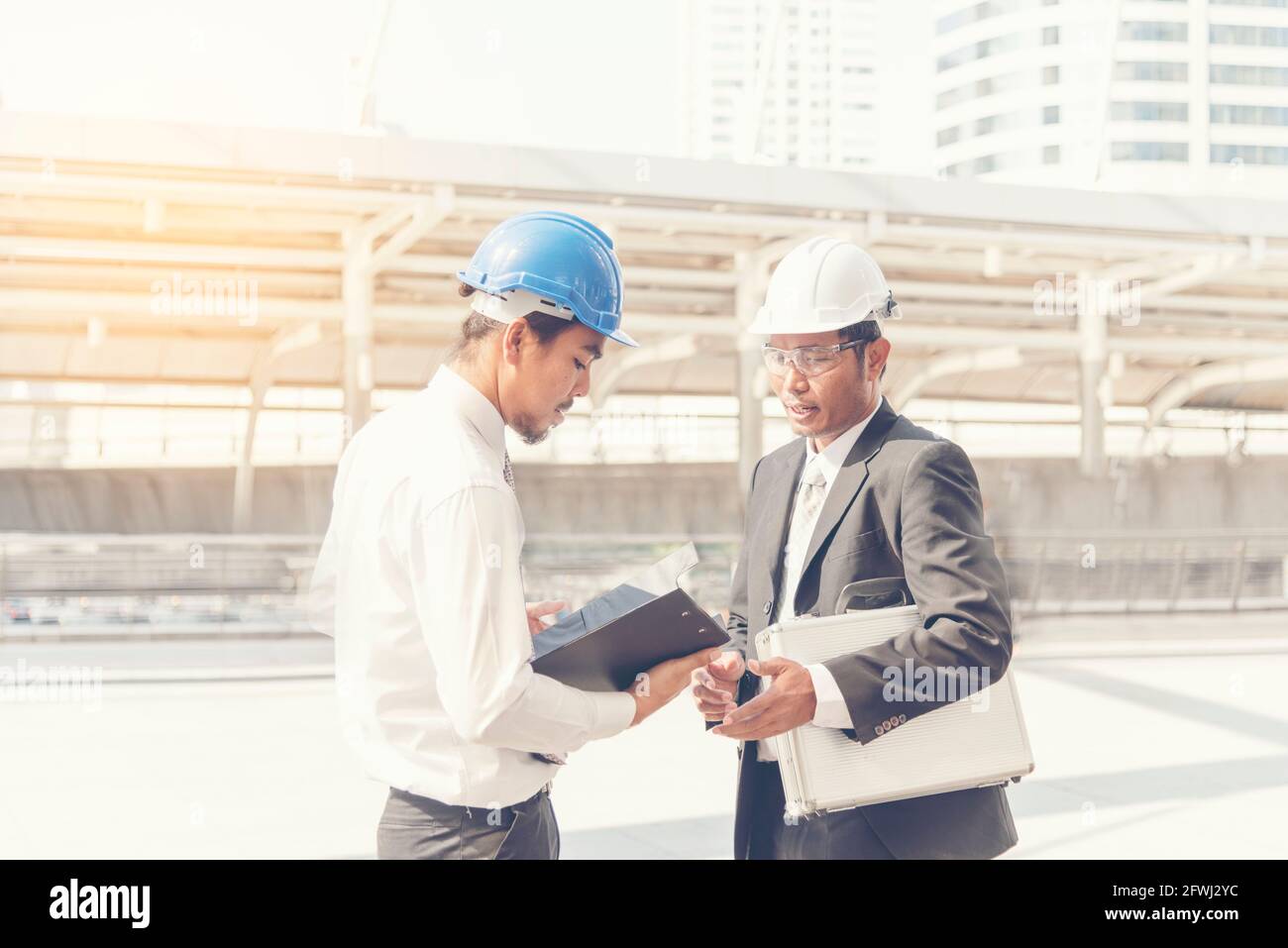 Business teamwork discussing on site. Interior design consulting with ...