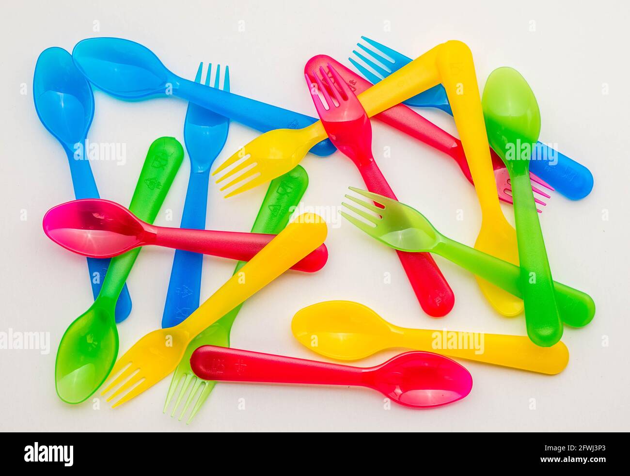 Isolated beautiful colorful baby spoons on white background, close up ...