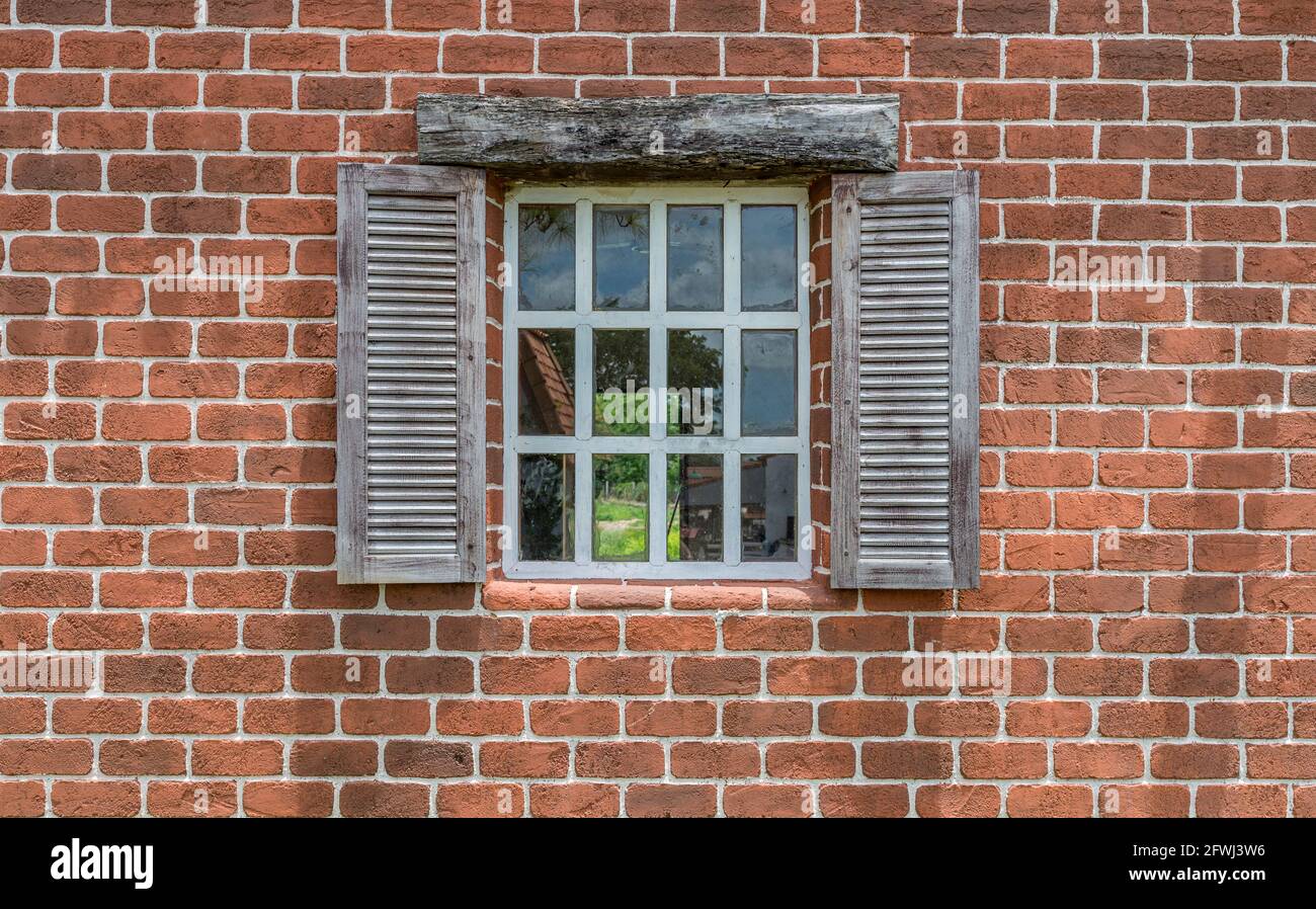 Beautiful window and brick wall. Have clipping path on window's glass ...