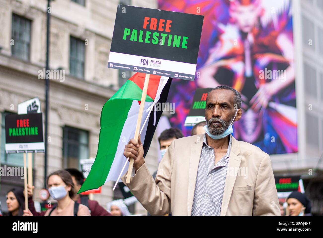 A protester holds a placard expressing his opinion during the ...