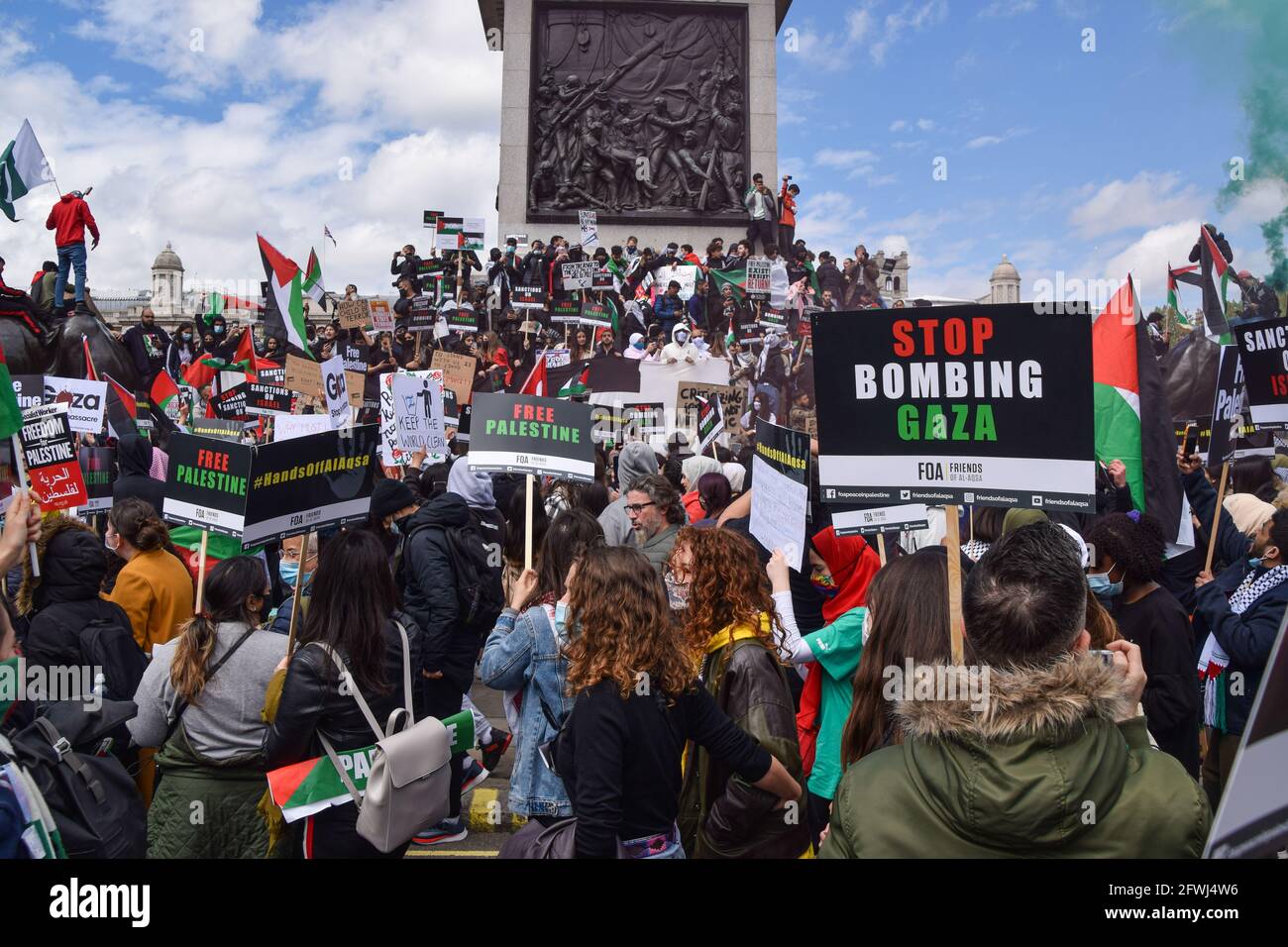 London, UK. 22nd May, 2021. Protesters hold placards and flags in ...