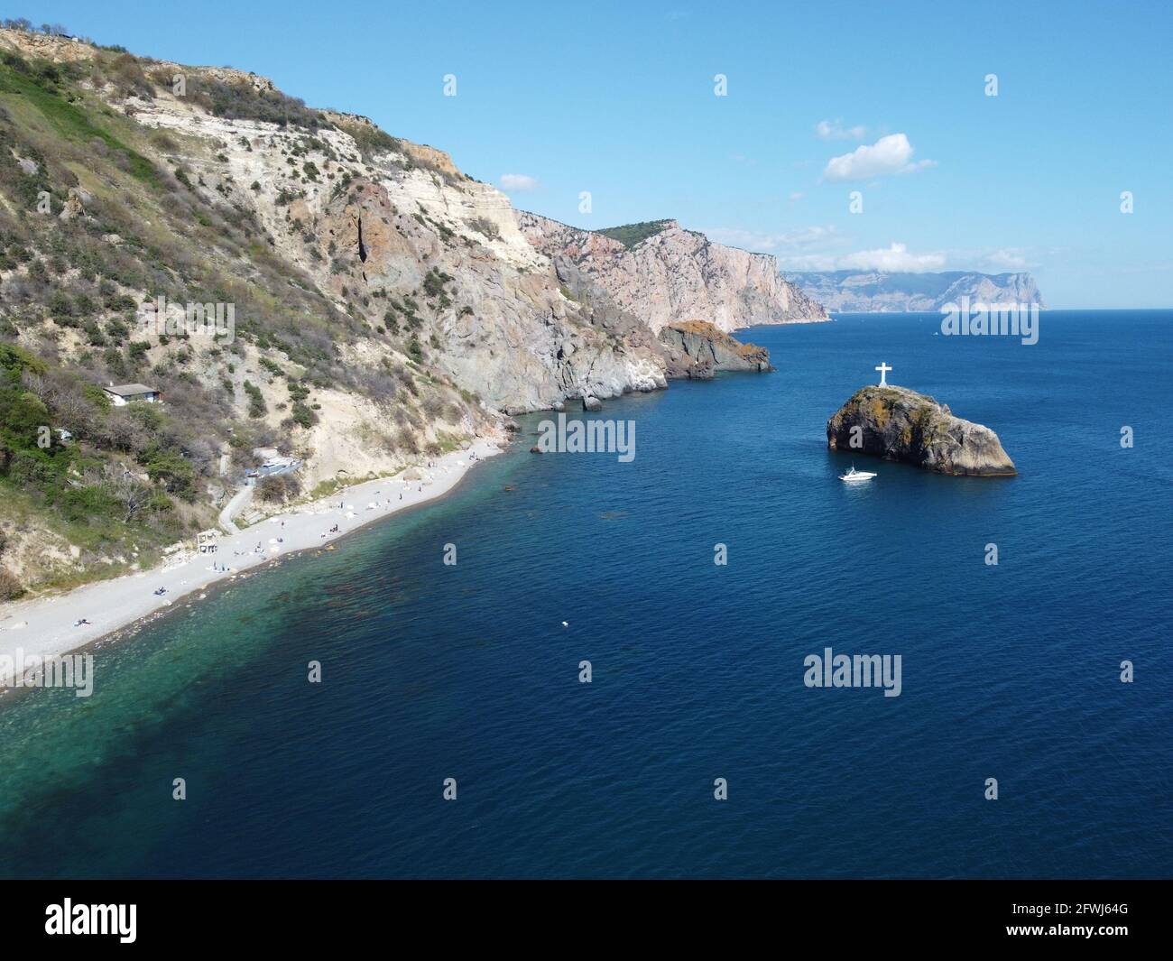 Aerial view from above on azure sea and rocky shores. Small waves on ...