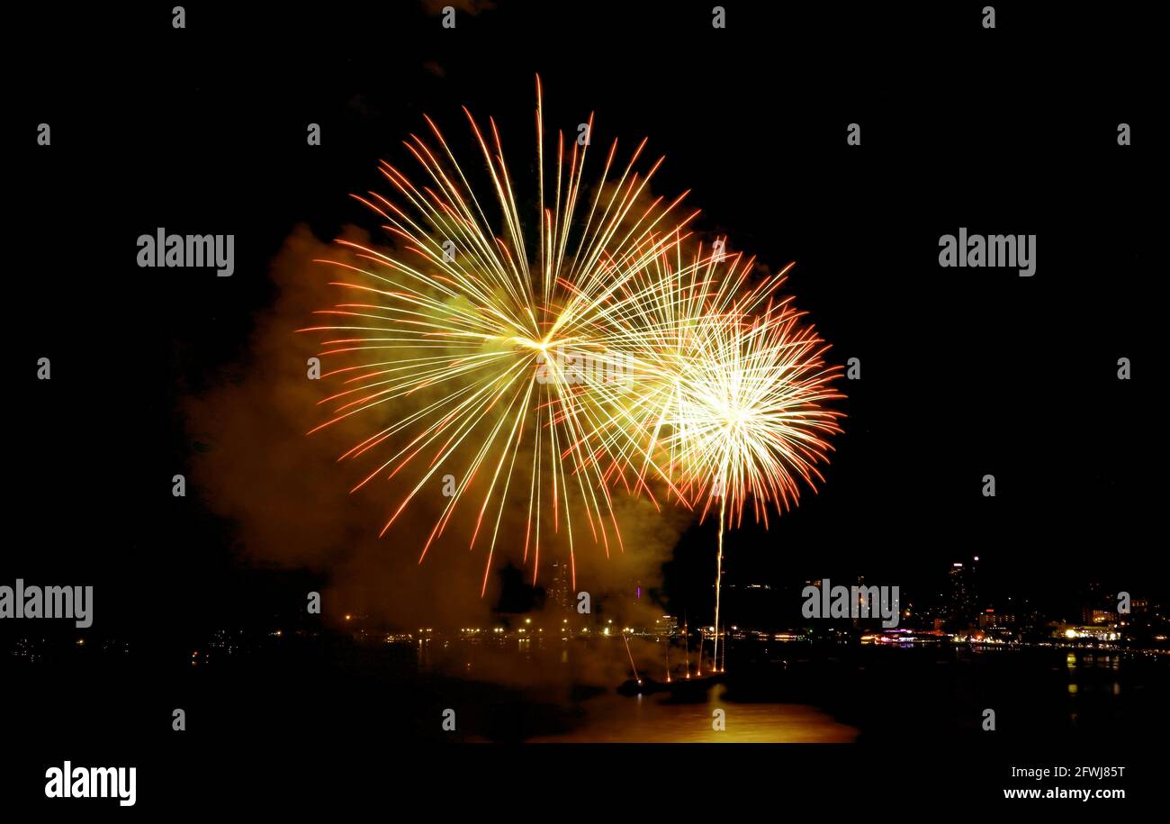 Spectacular fireworks exploding in to the night sky over the bay Stock ...