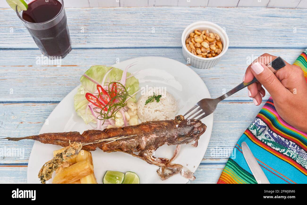 Peruvian cuisine: Cabrilla frita, fried fish . Selective Focus Stock ...