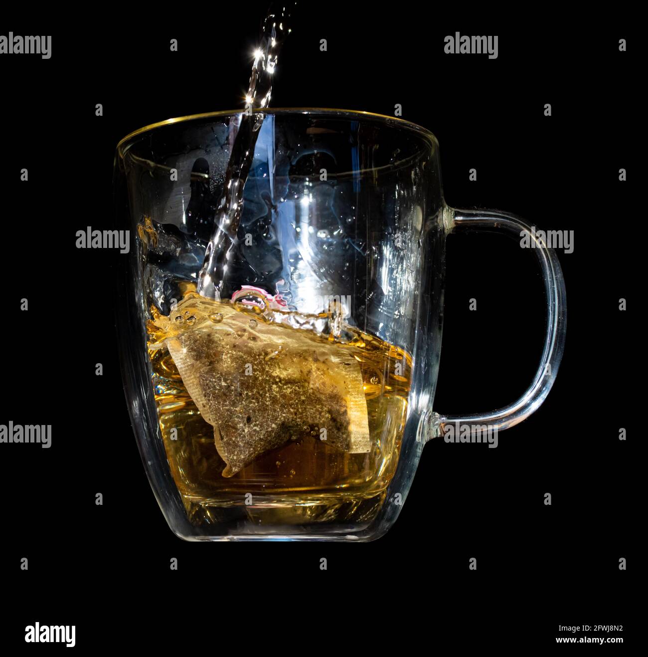 Pouring water into cup hi-res stock photography and images - Alamy