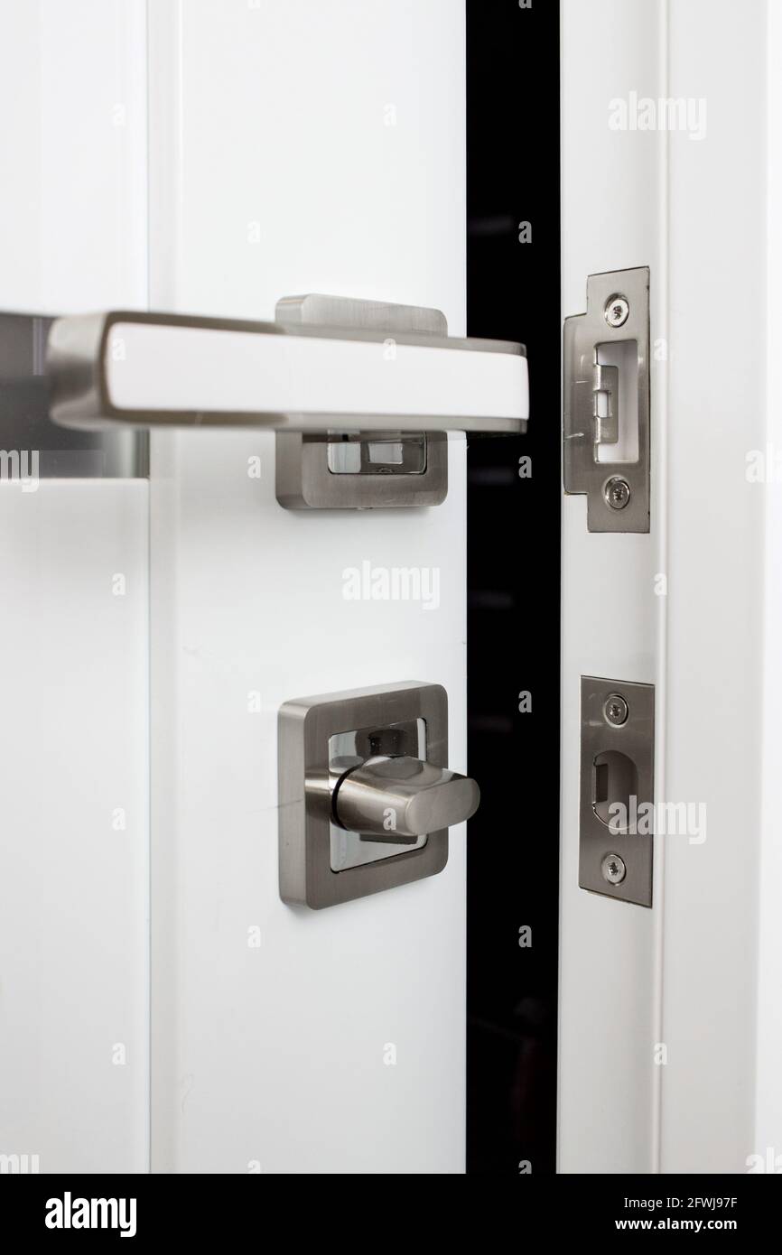 Interior door modern handle and Security lock Stock Photo - Alamy