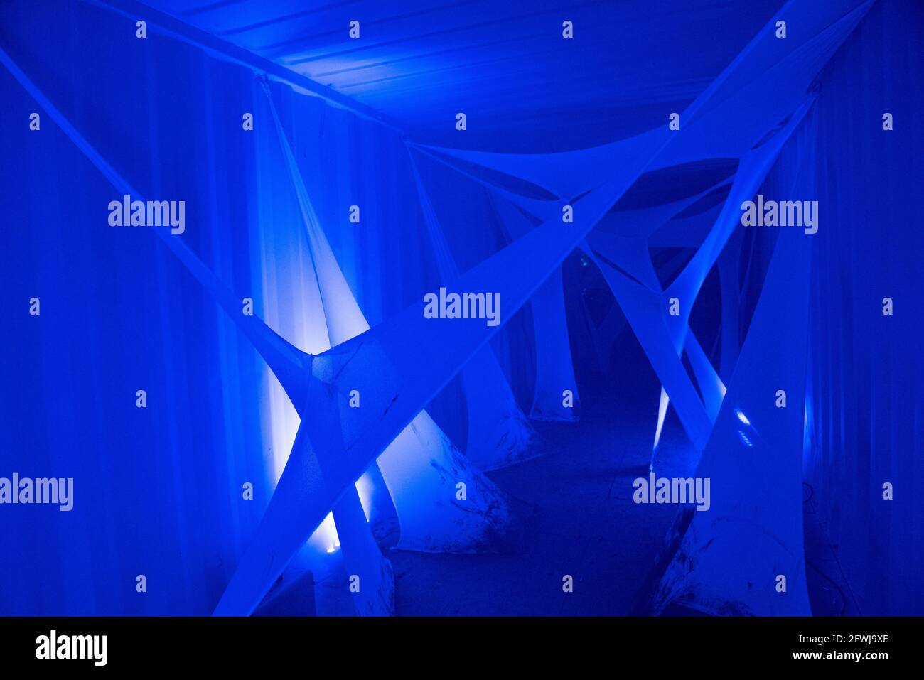 Abstract blue veiled tunnel, artistic installation Stock Photo - Alamy